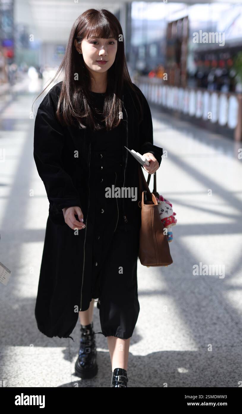 Chinese idol singer and actress Li Yitong appears at the airport in ...