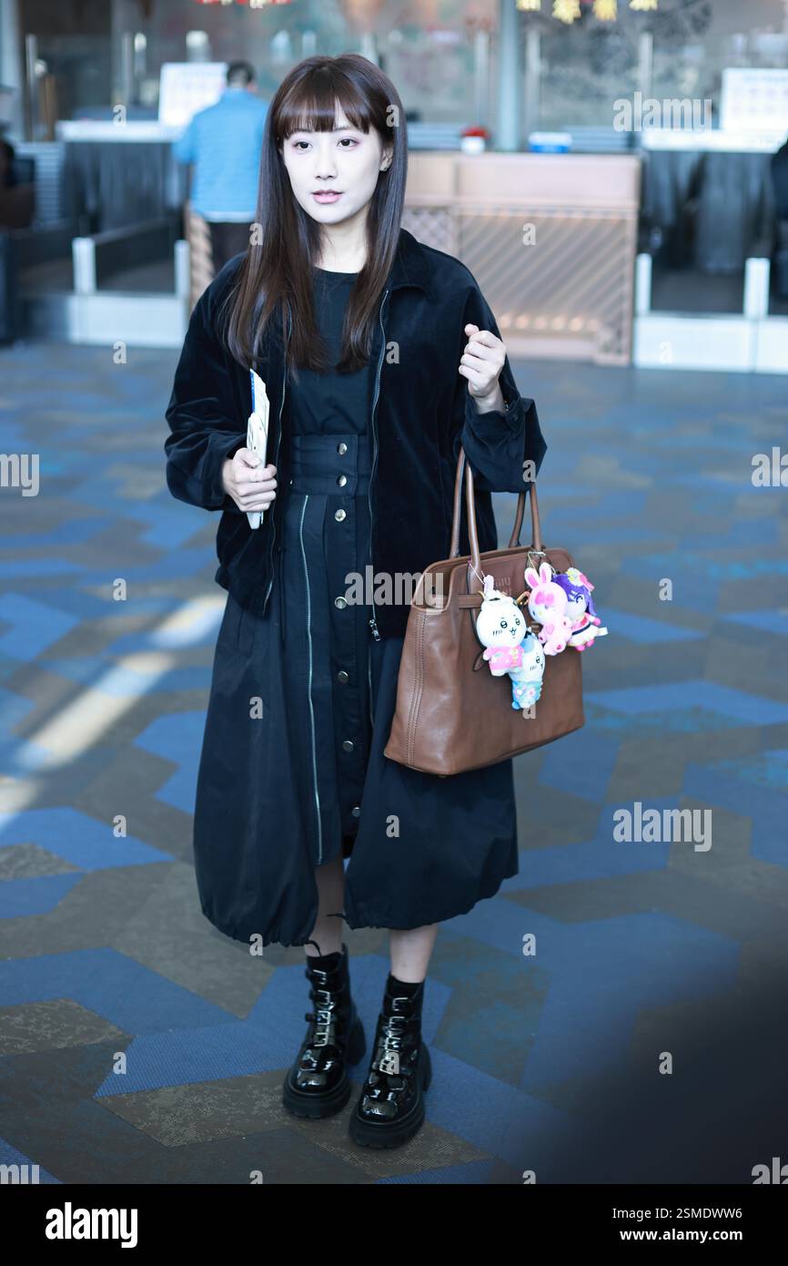 Chinese idol singer and actress Li Yitong appears at the airport in ...