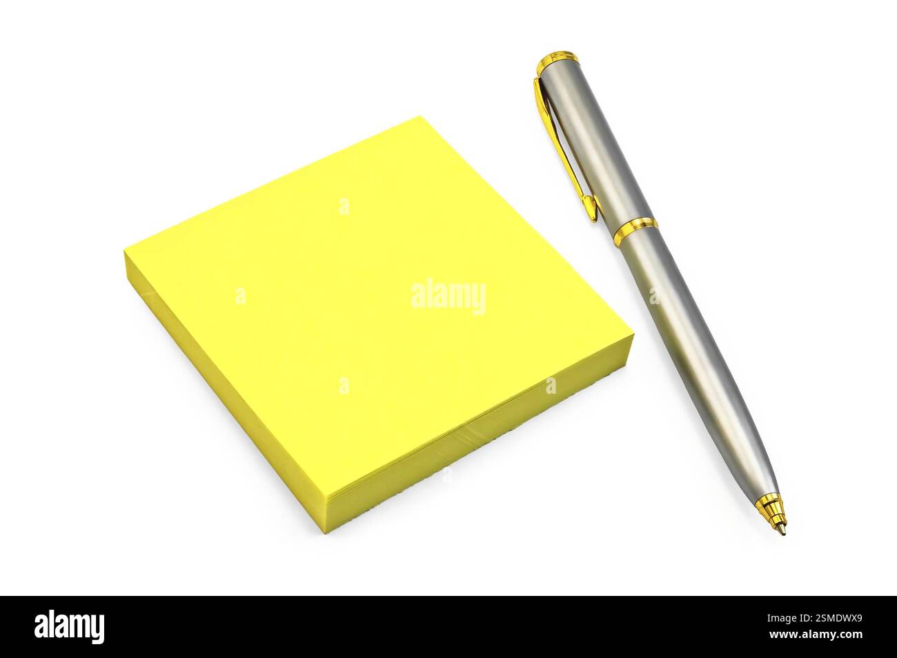 Block yellow office paper with a silver metal handle isolated on white ...