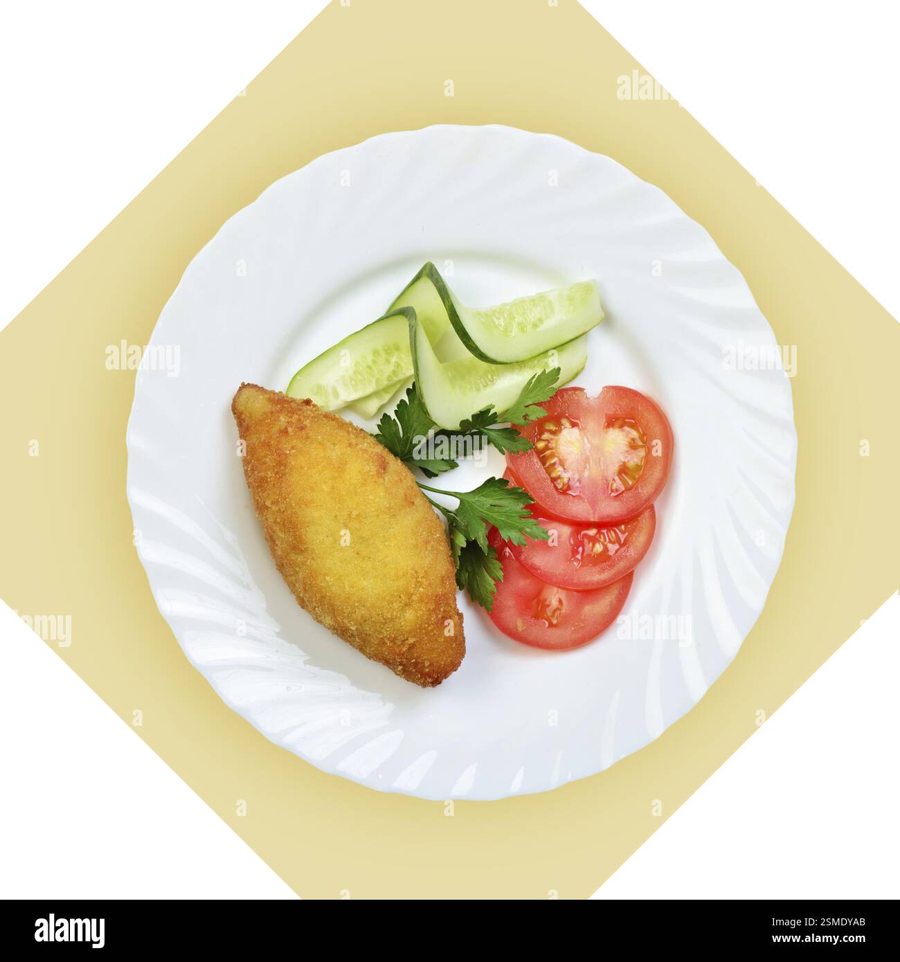 Dish of chicken Kiev cutlet with vegetables on white plate. Isolated ...