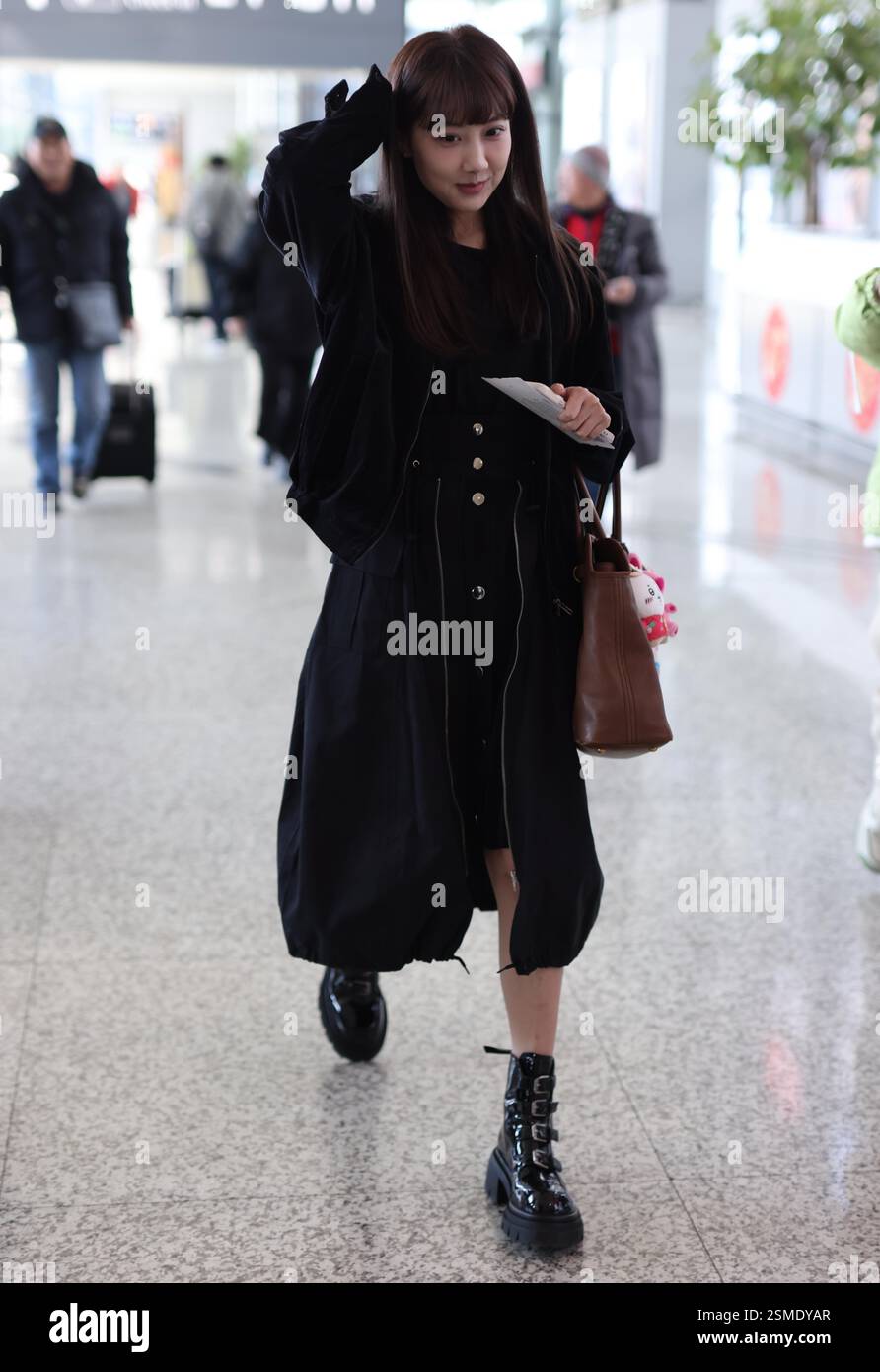 Chinese idol singer and actress Li Yitong appears at the airport in ...