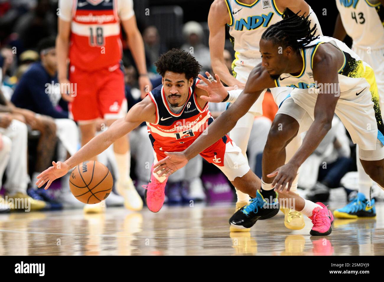 Washington Wizards guard Jordan Poole (dives for the ball against ...