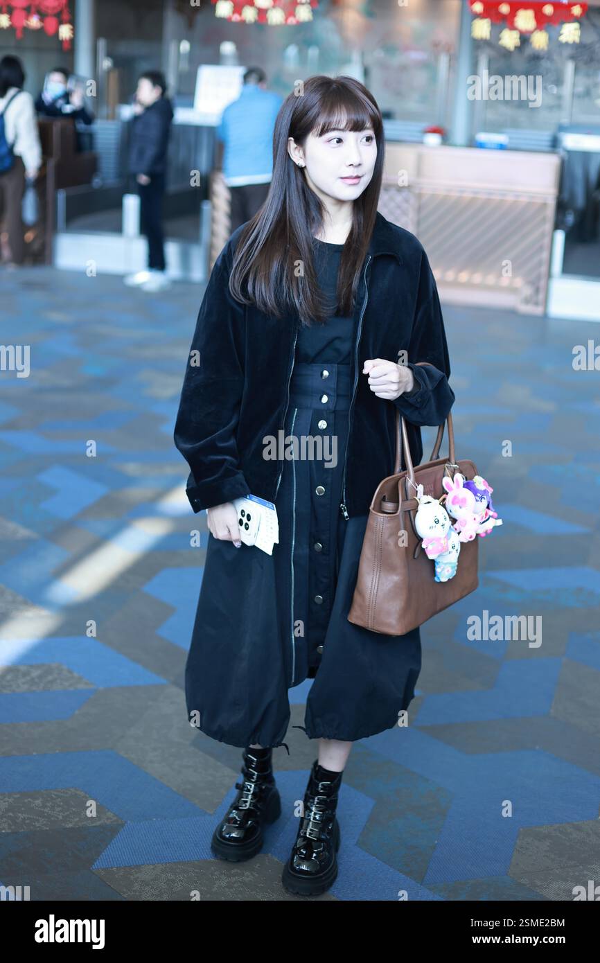 Chinese idol singer and actress Li Yitong appears at the airport in ...