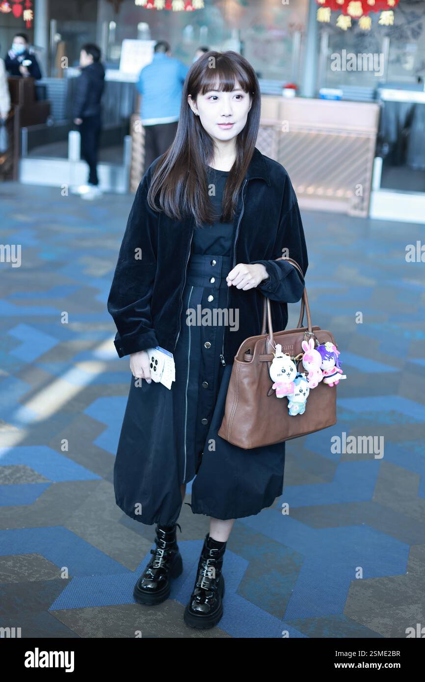 Chinese idol singer and actress Li Yitong appears at the airport in ...