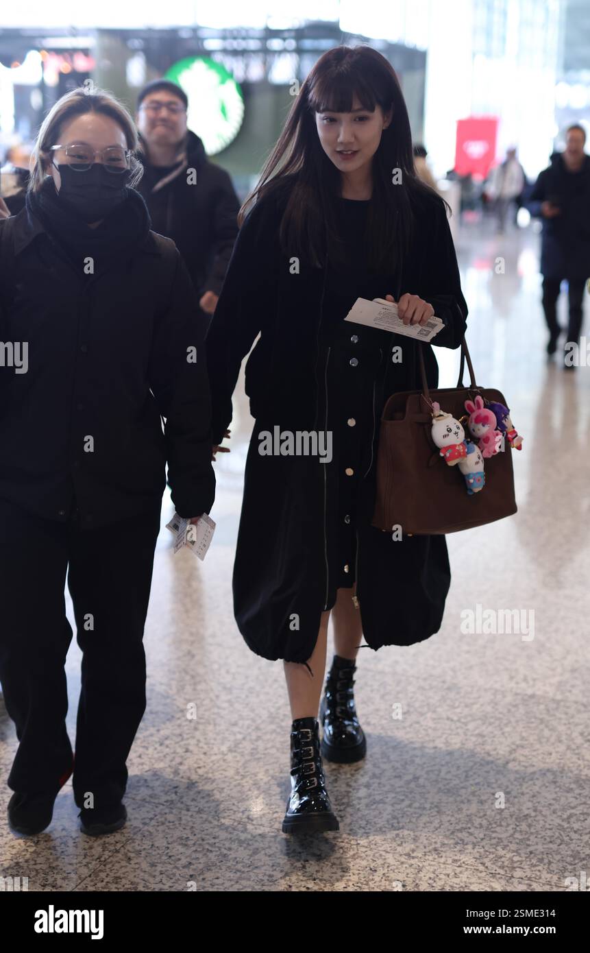 Chinese idol singer and actress Li Yitong appears at the airport in ...