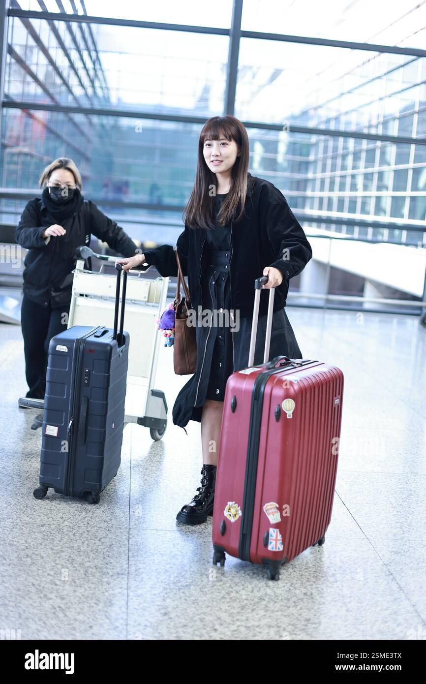 Chinese idol singer and actress Li Yitong appears at the airport in ...
