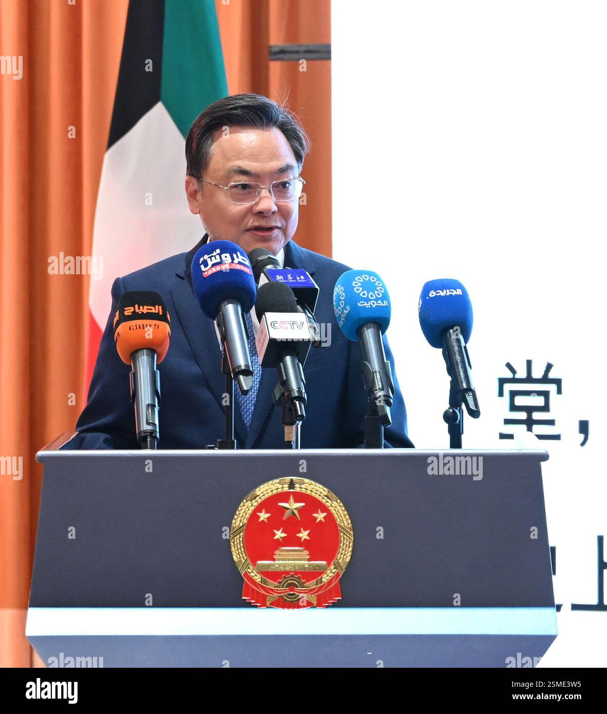 Hawalli Governorate, Kuwait. 12th Feb, 2025. Chinese Ambassador Zhang Jianwei speaks during a ...