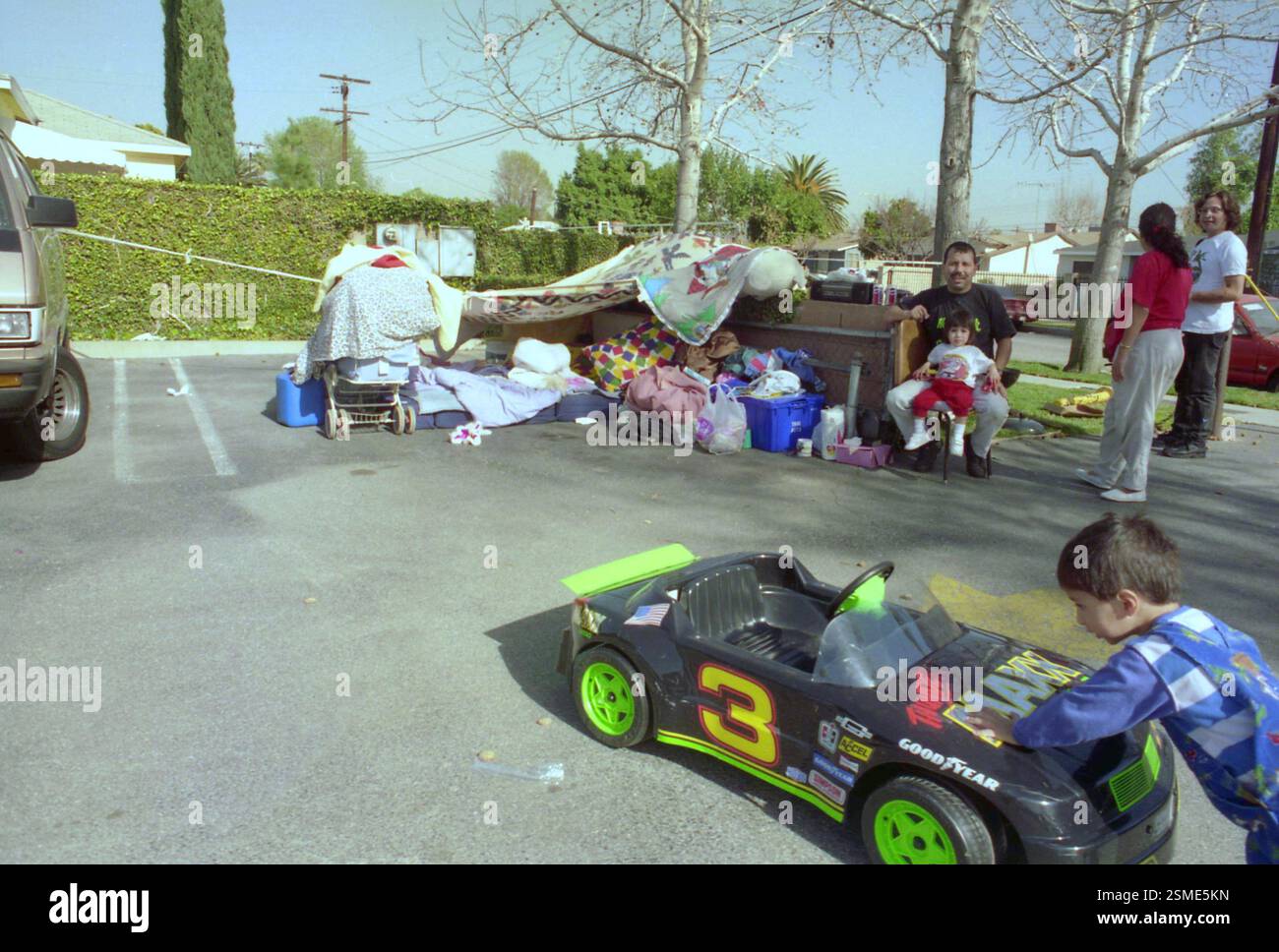 Los Angeles, CA, USA, January 1994. Residents sitting outside of an ...
