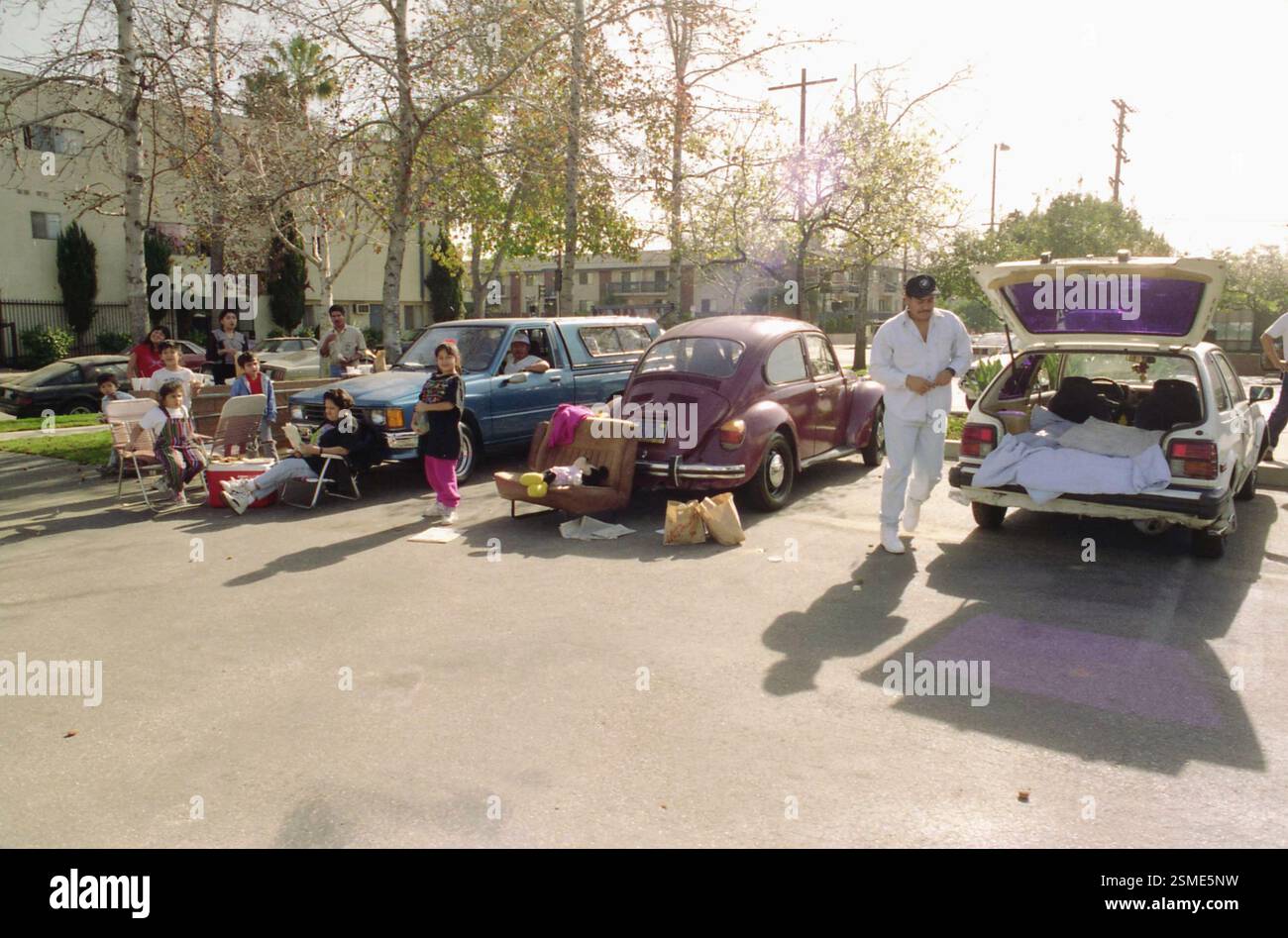 Los Angeles, CA, USA, January 1994. Residents sitting outside of an ...