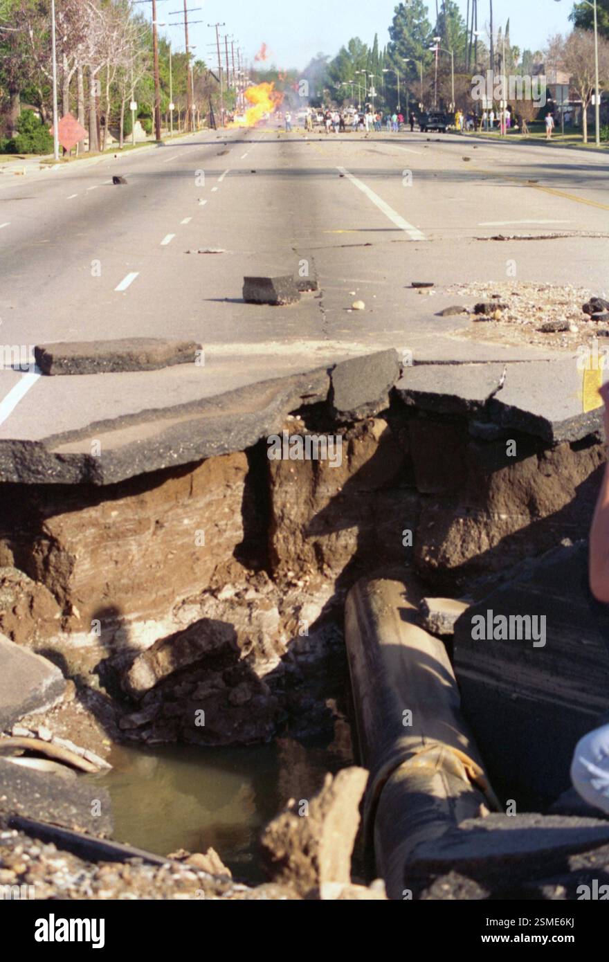 Los Angeles, CA, USA, January 1994. Damaged road with pipe exposed seen ...