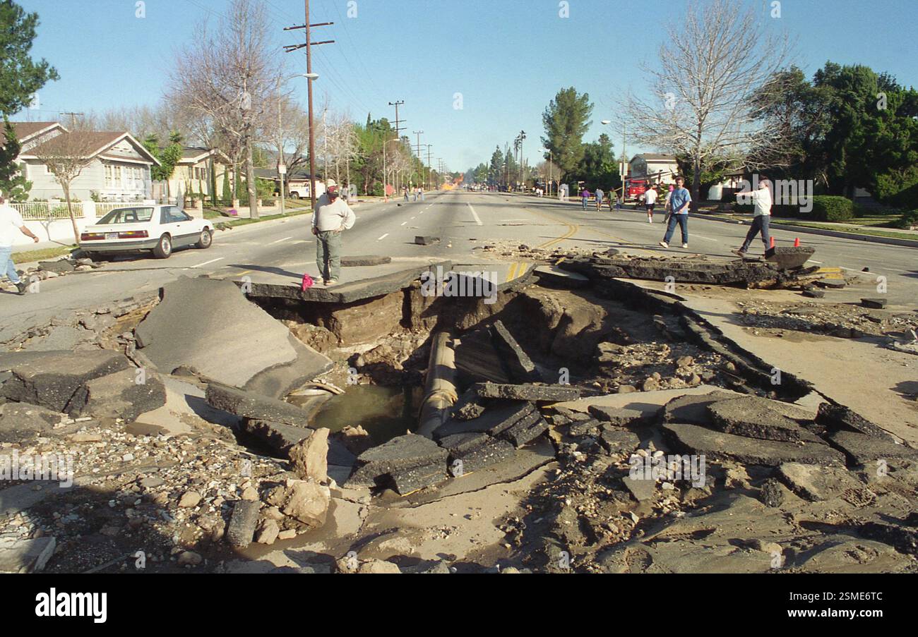 Los Angeles, CA, USA, January 1994. Damaged road with pipe exposed seen ...