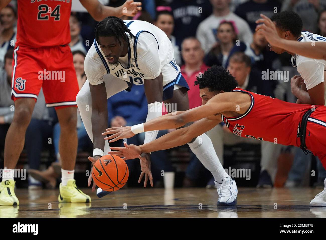 Villanova's Enoch Boakye, left, and St. John's RJ Luis Jr. reach for a ...