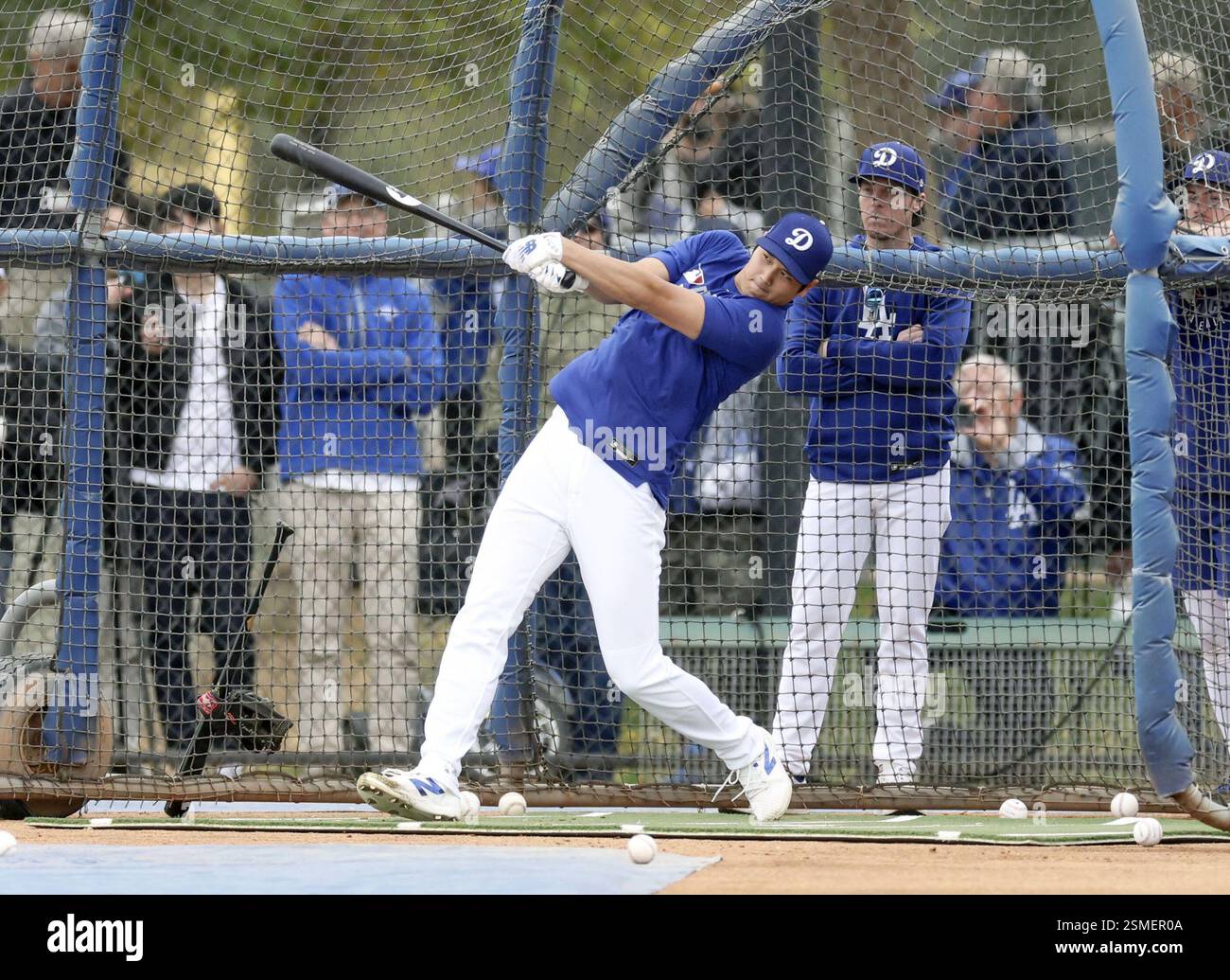 Shohei Ohtani takes batting practice at spring training with the Los ...