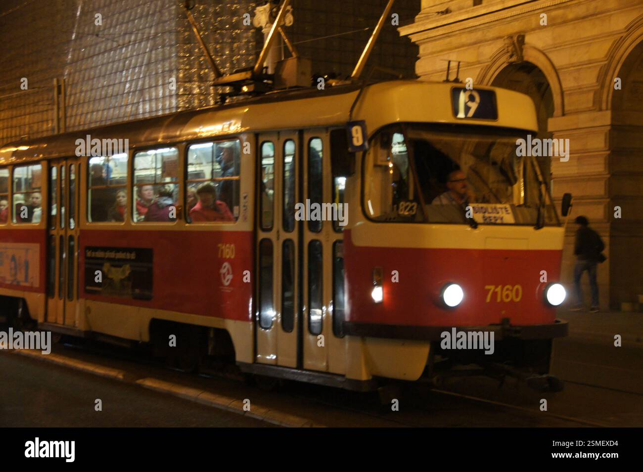 Prague Night Tram, Tatra T3R.P. Red and white tram illuminated against ...