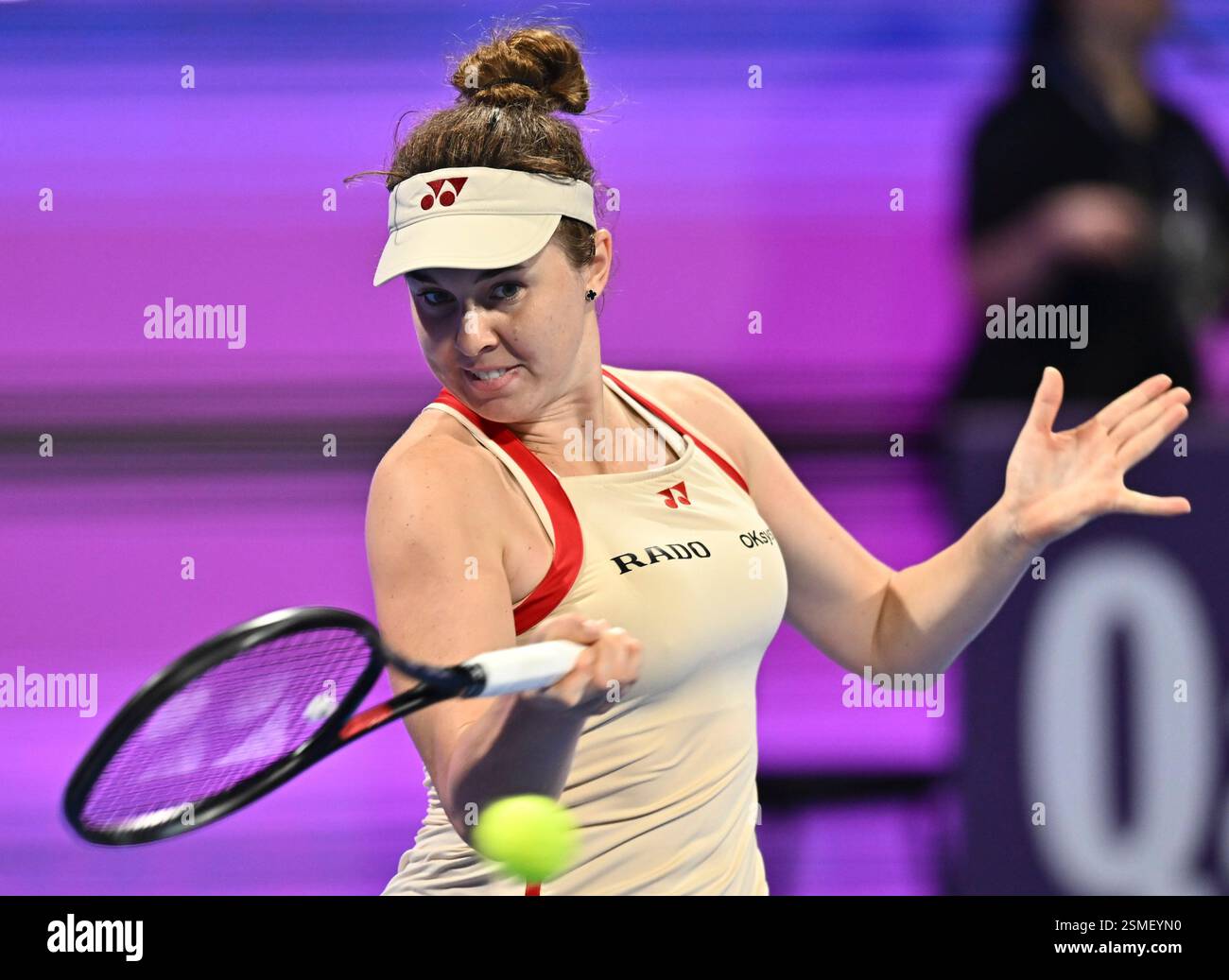 Doha, Qatar. 12th Feb, 2025. Linda Noskova of the Czech Republic hits a ...