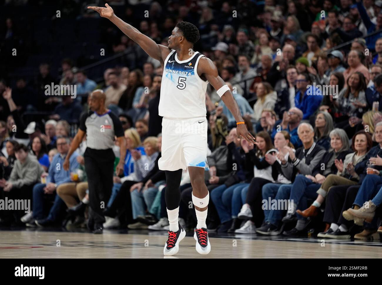 Minnesota Timberwolves guard Anthony Edwards (5) reacts after making a ...