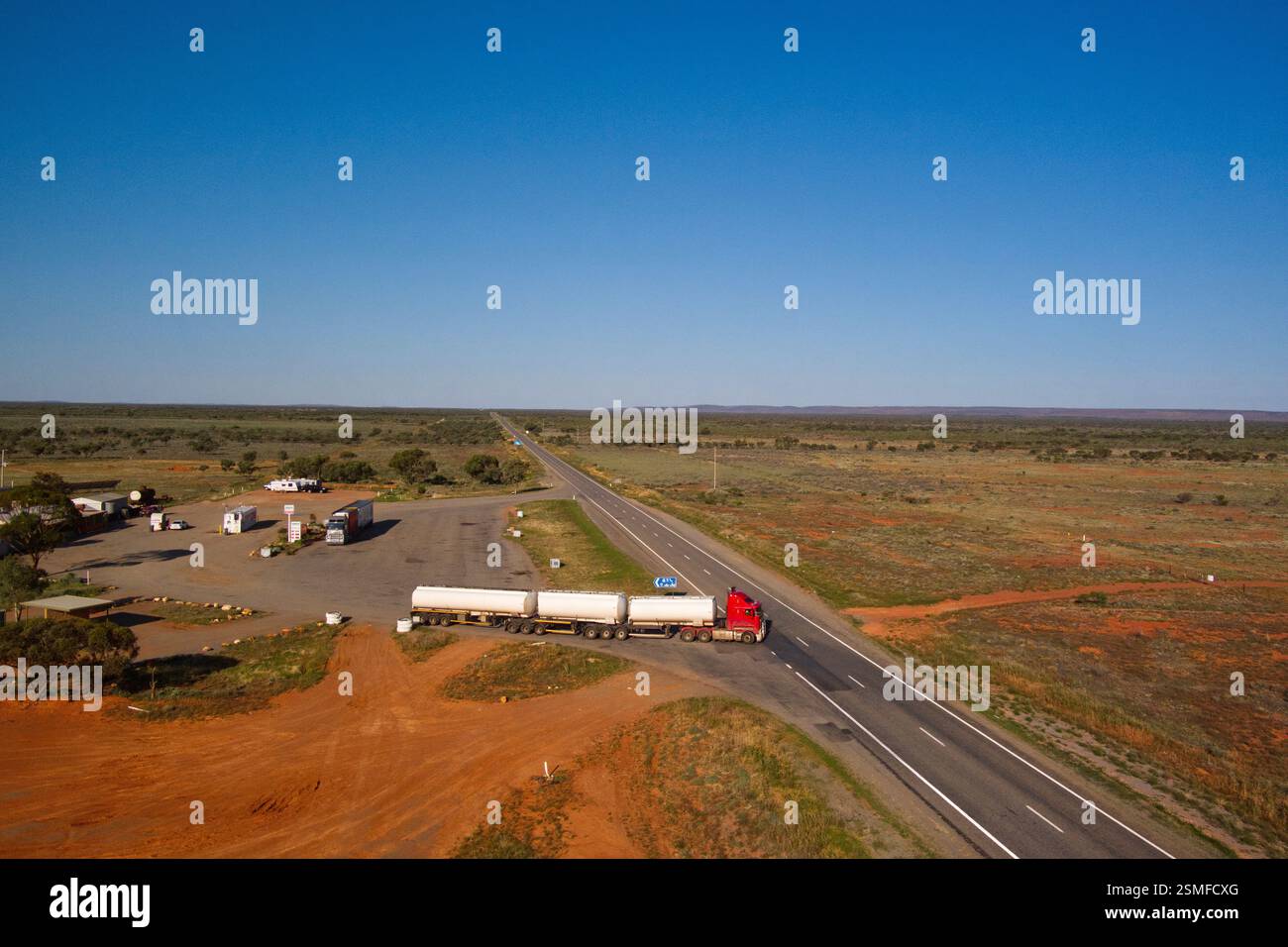 Aerial of a B Triple Fuel Tanker Truck pulling onto the Barrier Highway ...