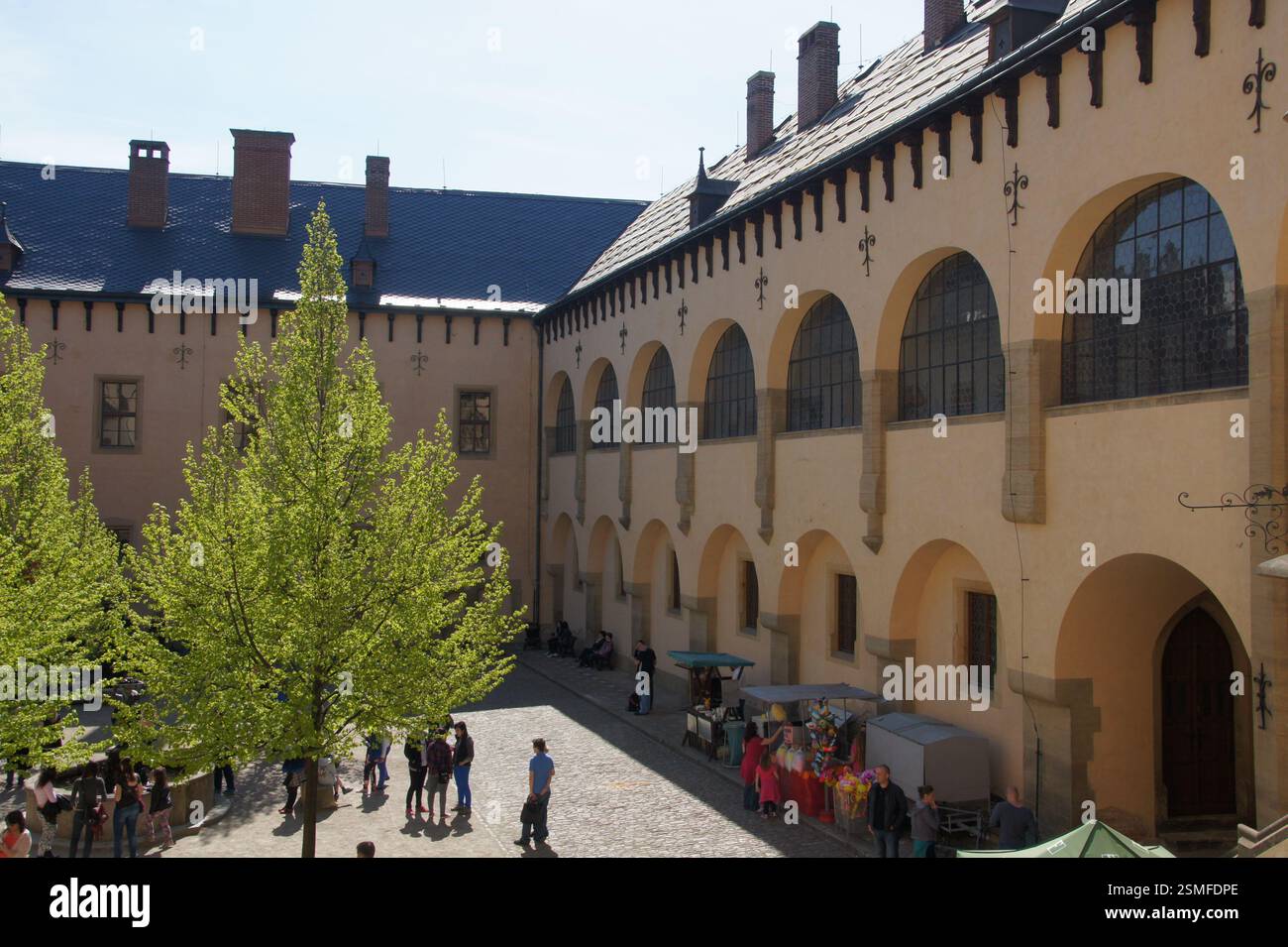 The Italian Court is a grand hall with ornate columns and chandeliers ...
