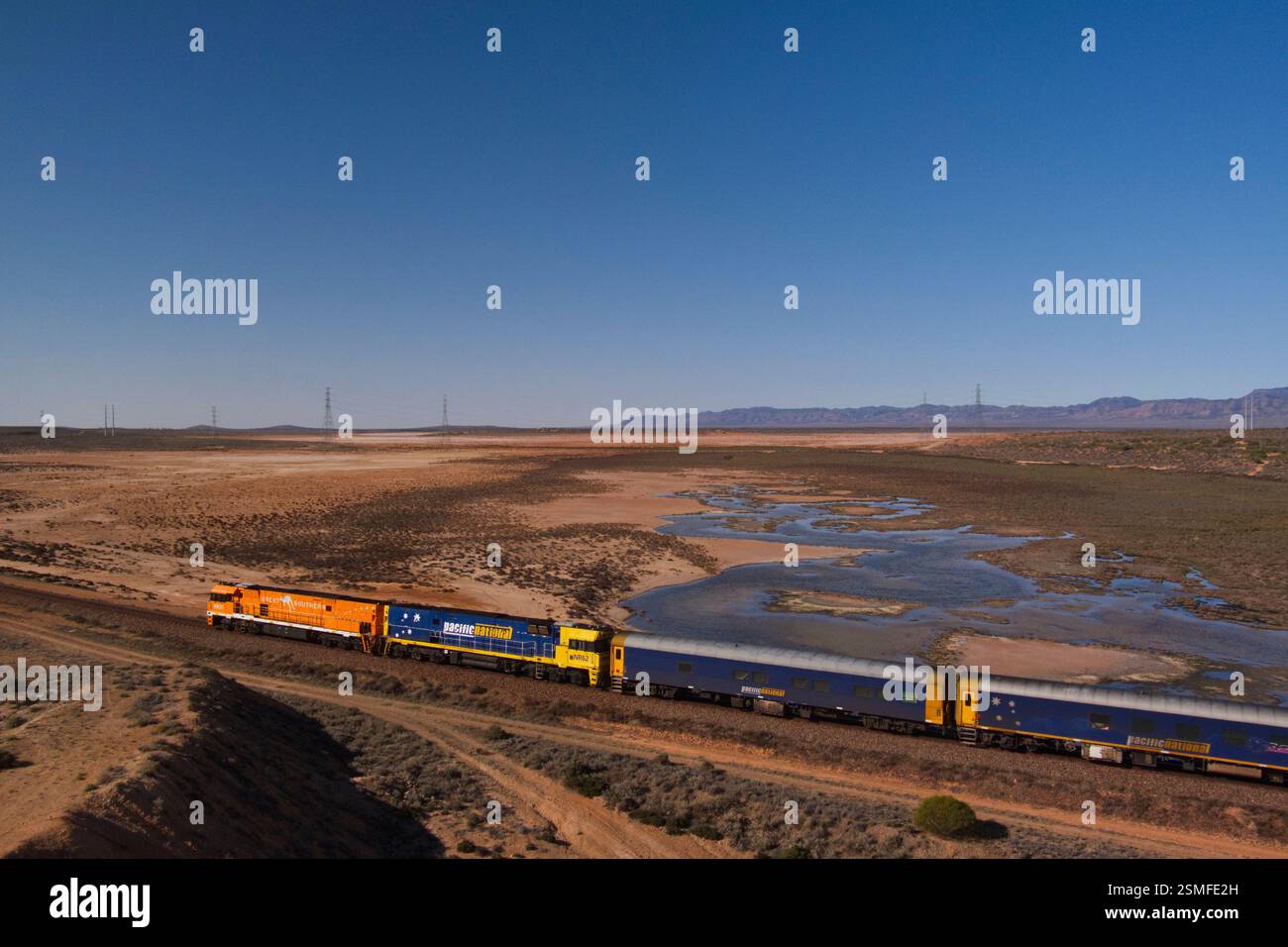 Aerial view of a freight train travelling through the outback region of ...