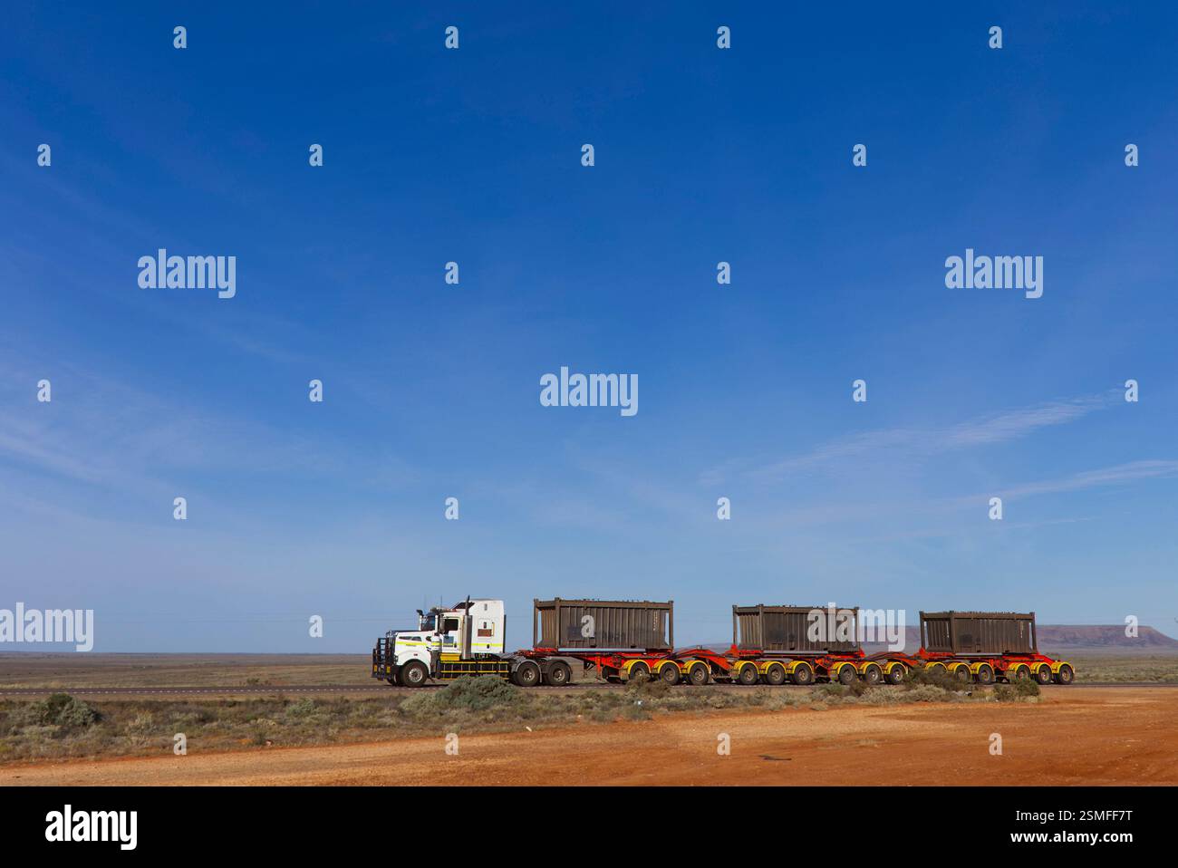 Side view of triple trailer Road Train travelling the Stuart highway in ...