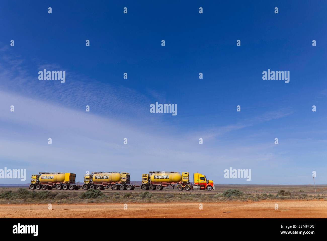 Side view of Kalari Pneumatic / Dry Bulk Tanker Road Train travelling ...