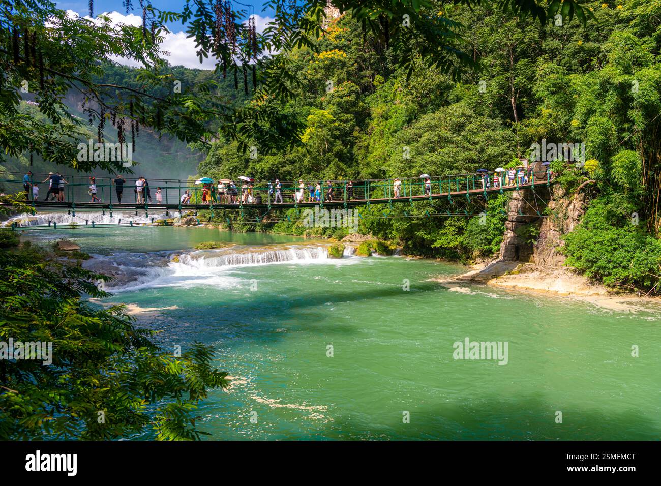 AUGUST 16, 2022, ANSHUN, CHINA: Suspension bridge over the Huangguoshu ...
