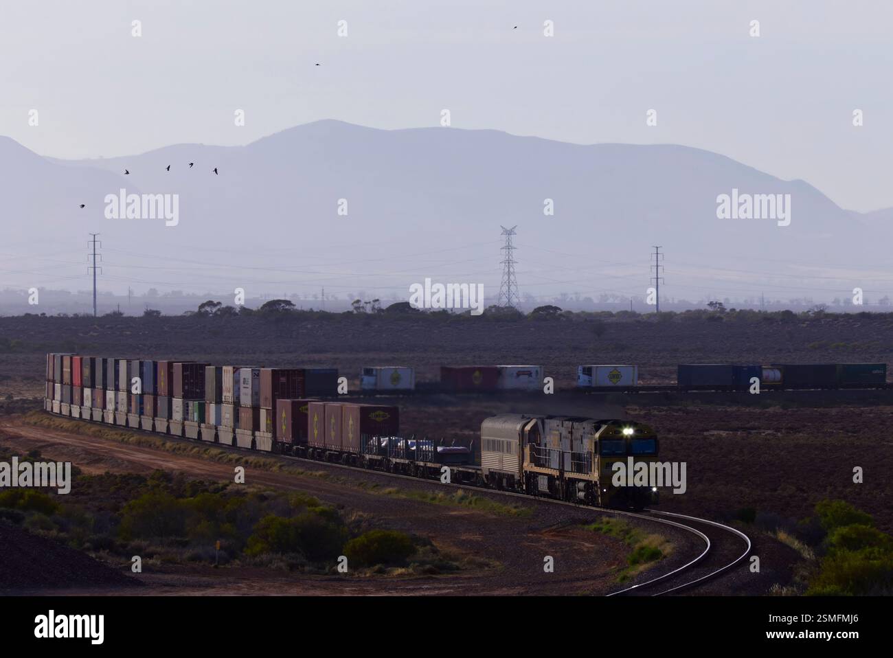 A freight train travelling through the outback of Port Augusta, South ...