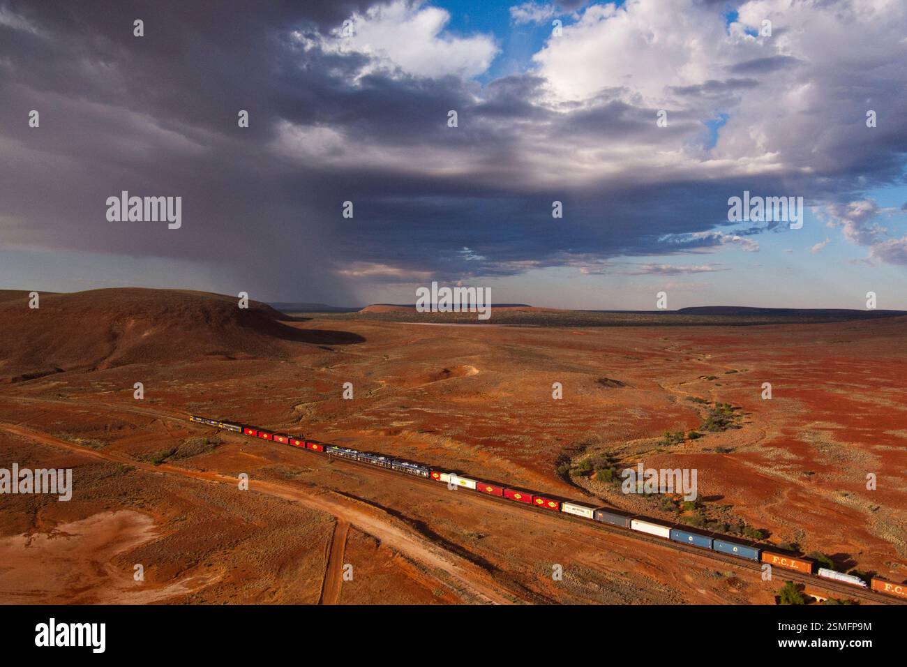 A freight train is seen travelling through the vast expanse of the ...