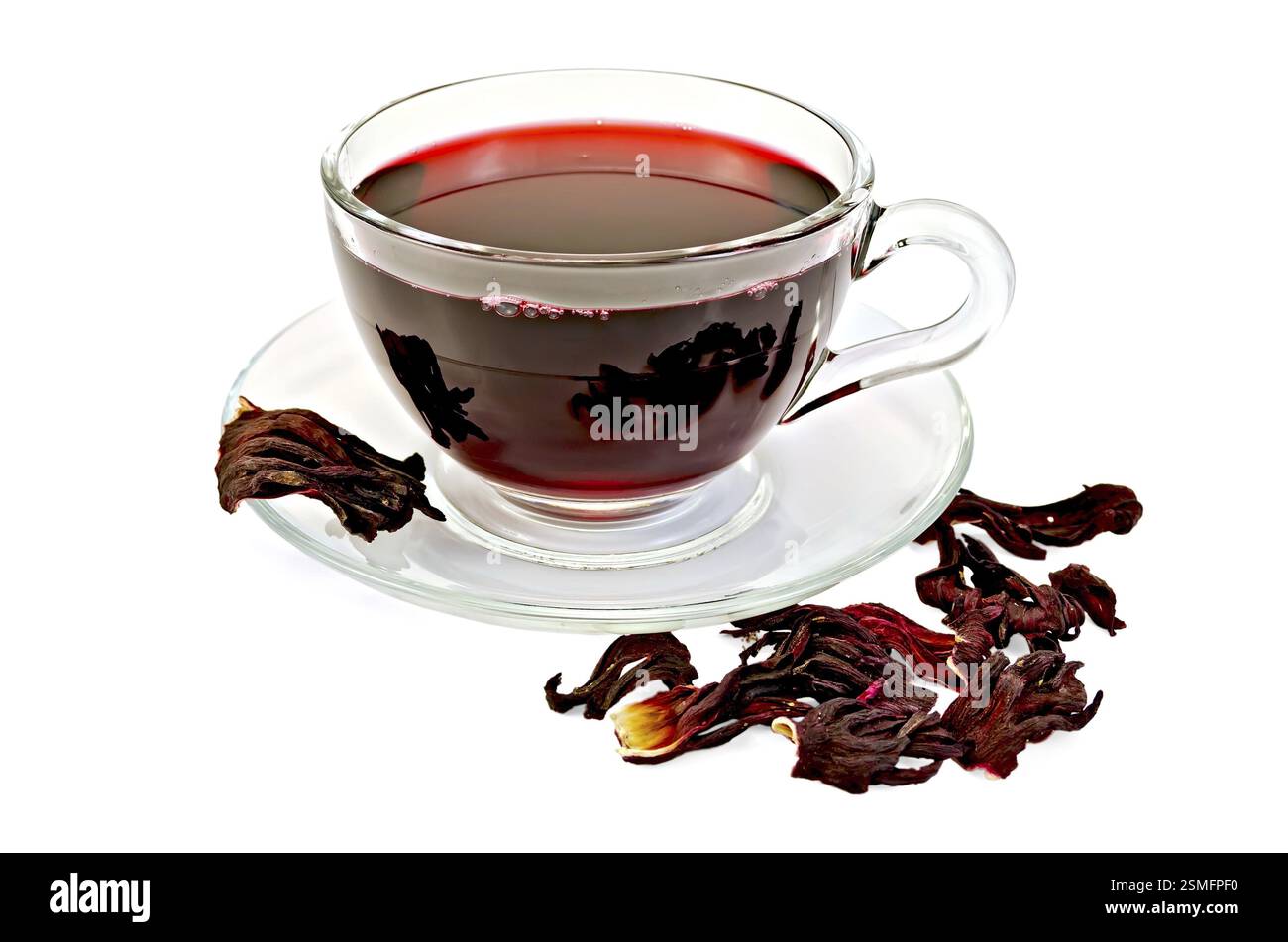 Hibiscus tea in a glass cup, dry petals tea isolated on white ...