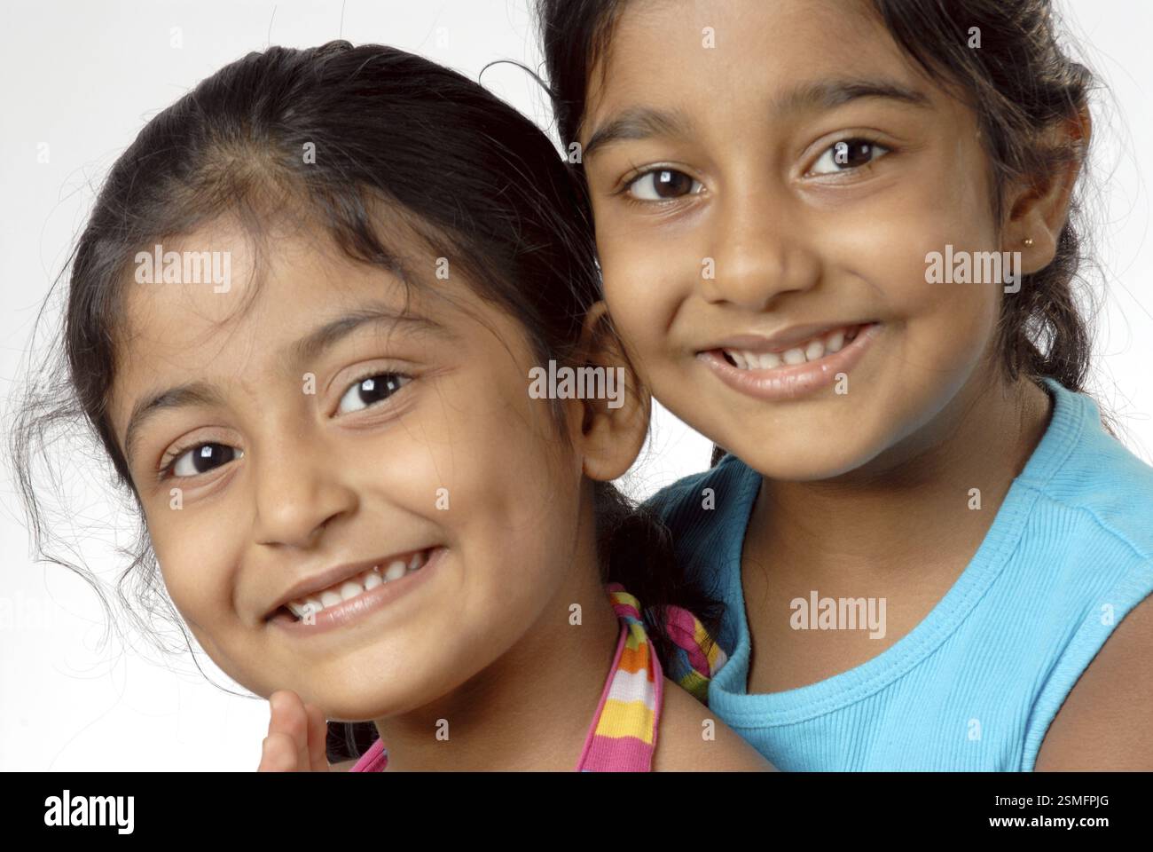 South Asian Indian two girls hugging each other and laughing MR#364 ...