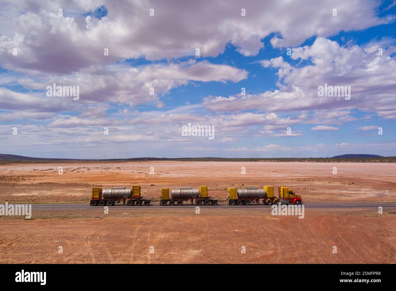 Side view of Triple B Road Train travelling the Stuart Highway South ...