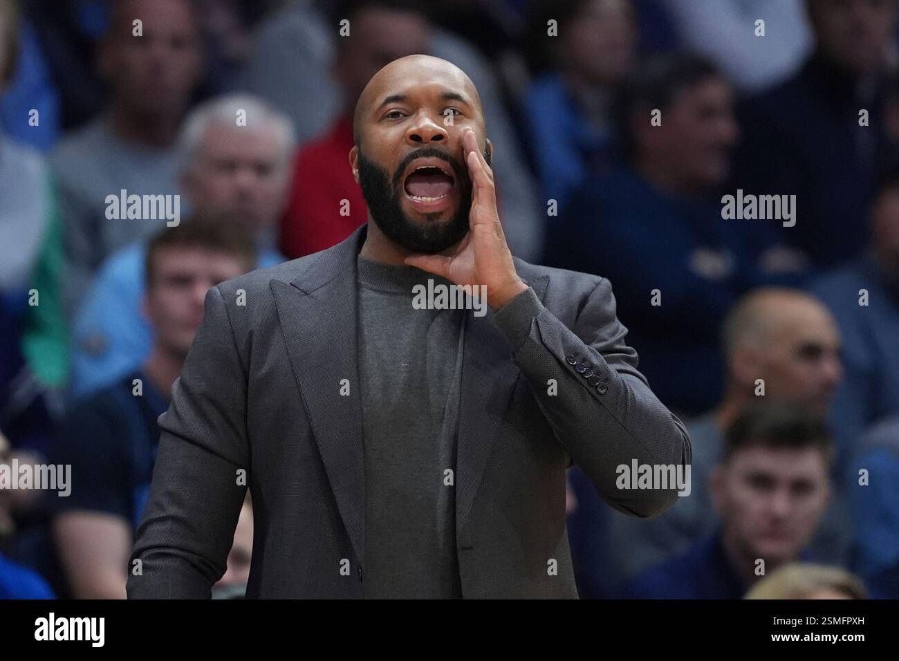 Villanova's Kyle Neptune coaches during an NCAA college basketball game ...