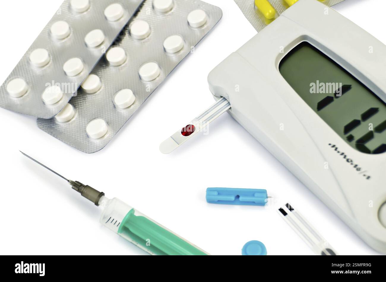 Grey instrument for measuring blood sugar with test strip, tablets and ...