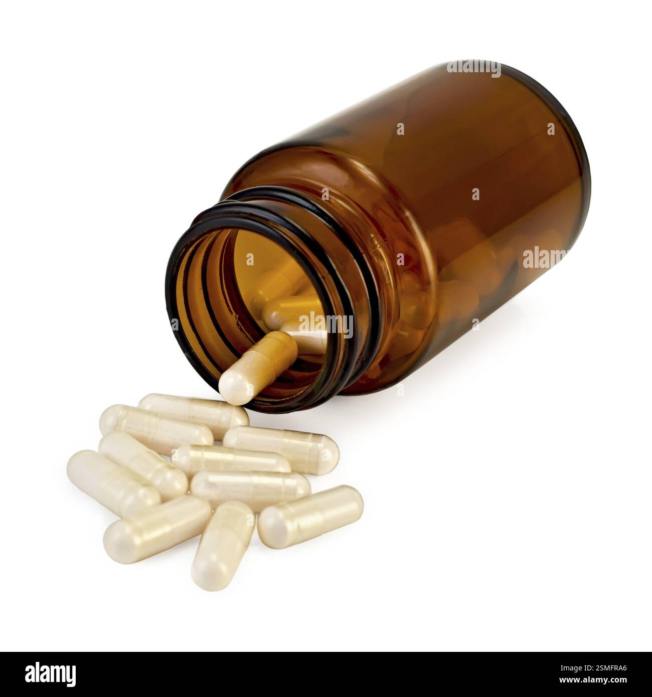 Capsules in an open brown jar and on the table isolated on white ...