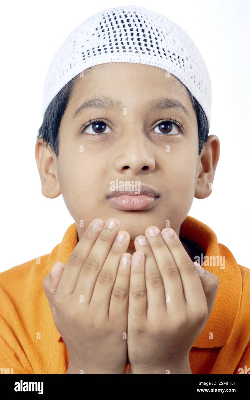 Muslim boy wearing topi praying namaz MR#152 Stock Photo - Alamy