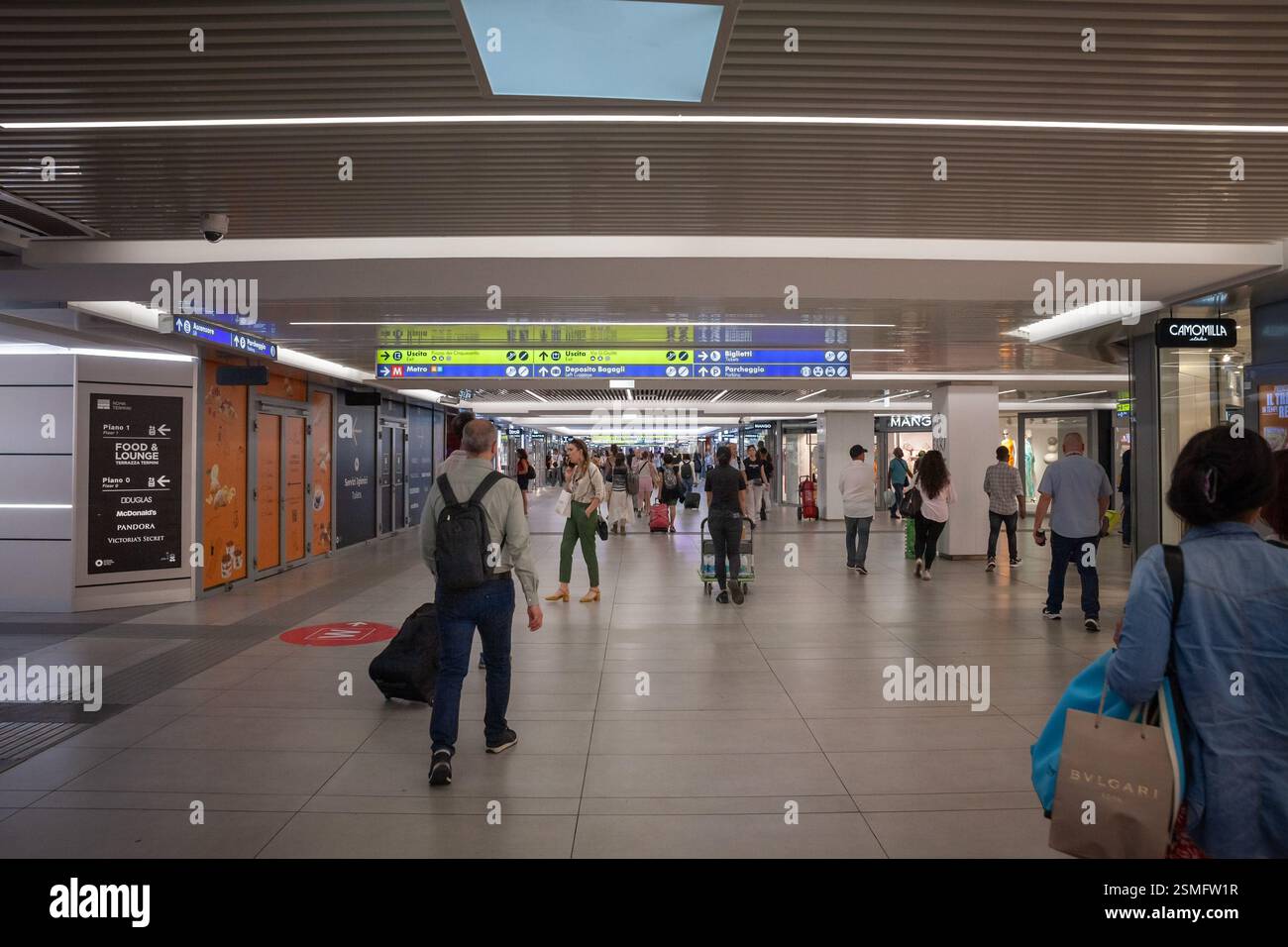 ROME, ITALY - JUNE 15, 2024: Passengers traverse the concourse of Roma ...
