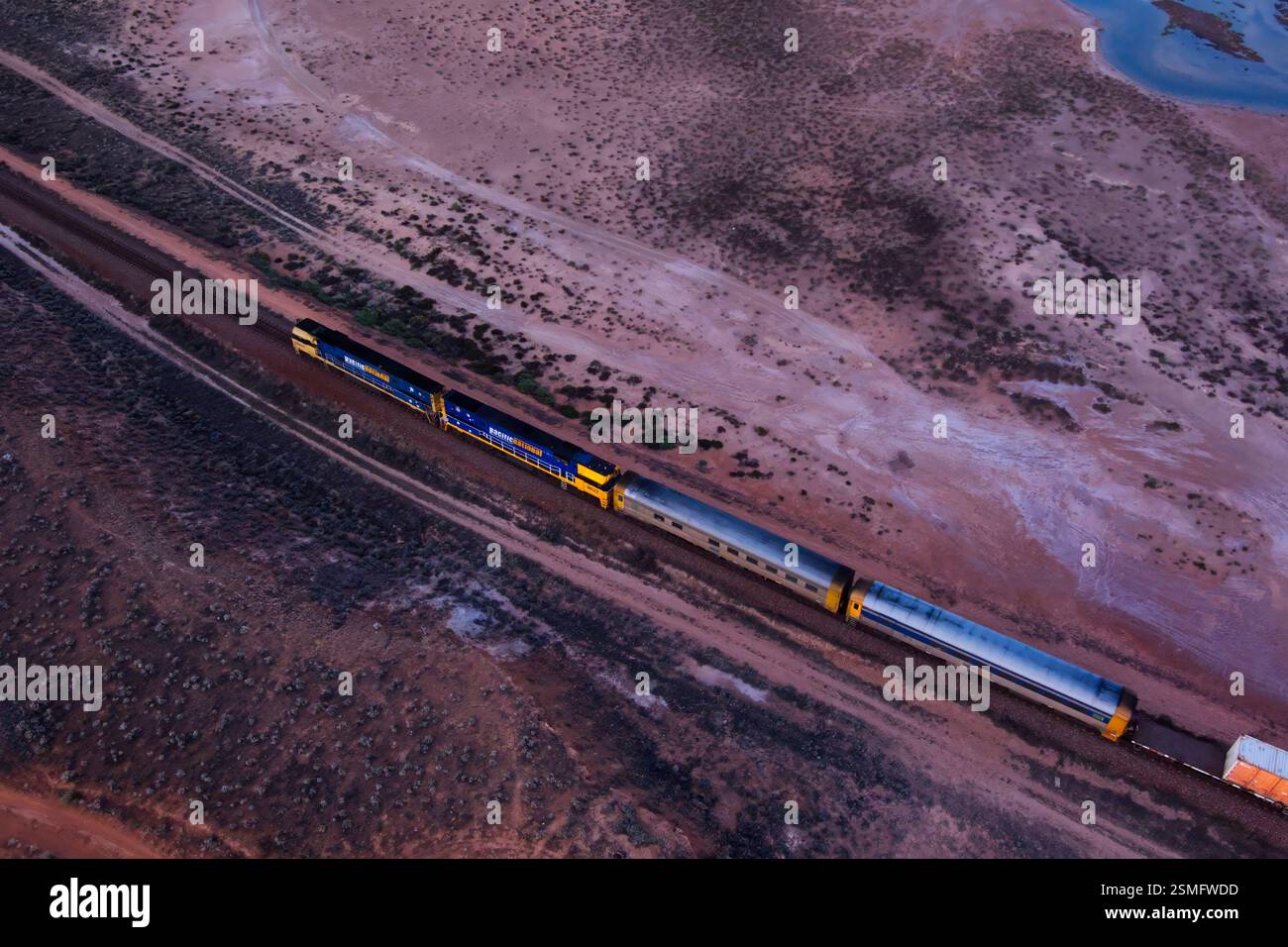 Aerial of Locomotives on a Intermodal container freight train passing ...