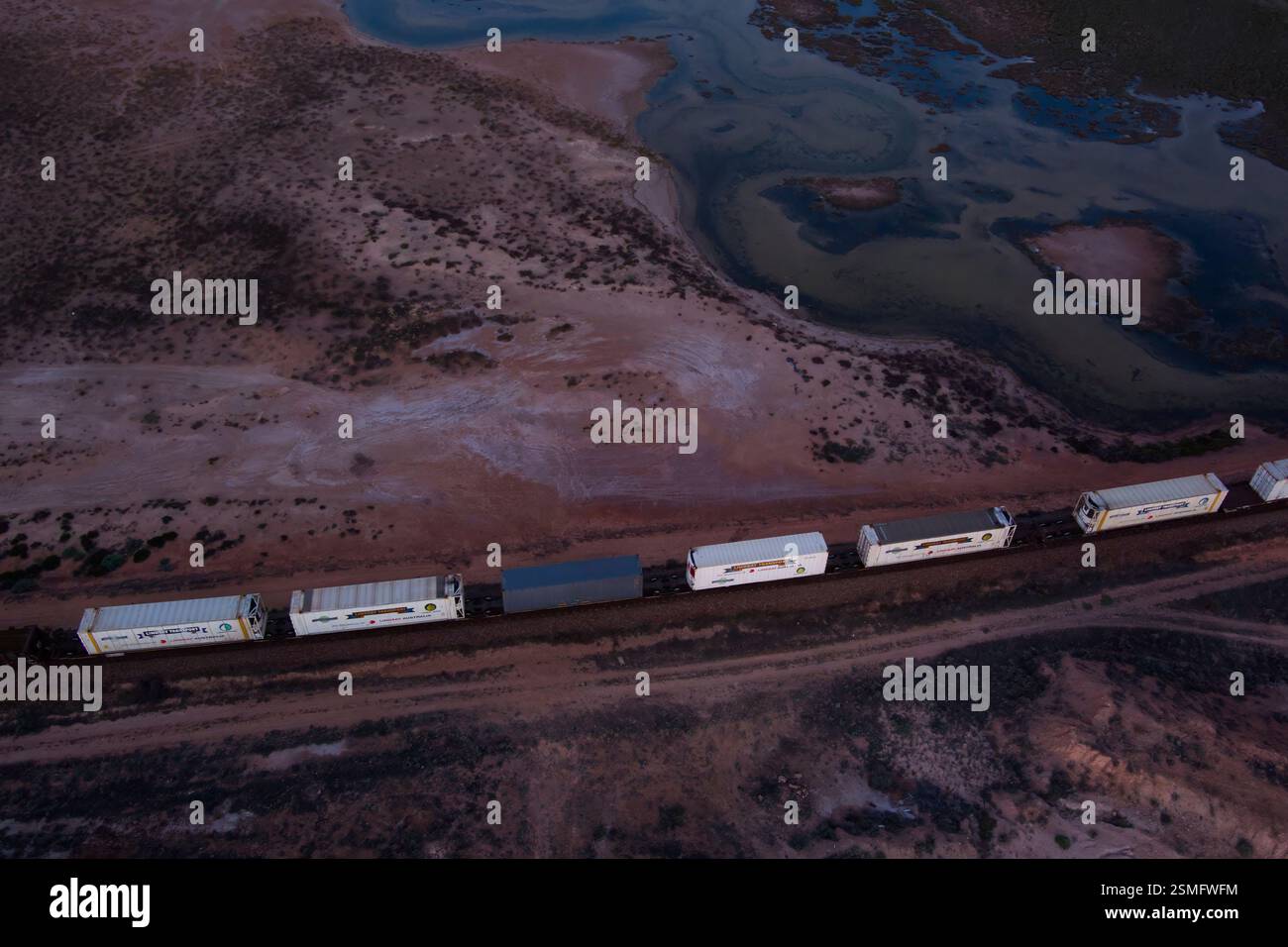 Aerial of Double Stacked Intermodal container freight train passing ...