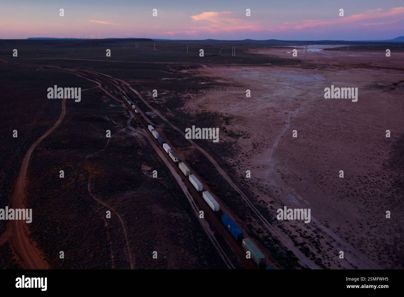 Aerial of Double Stacked Intermodal container freight train passing ...