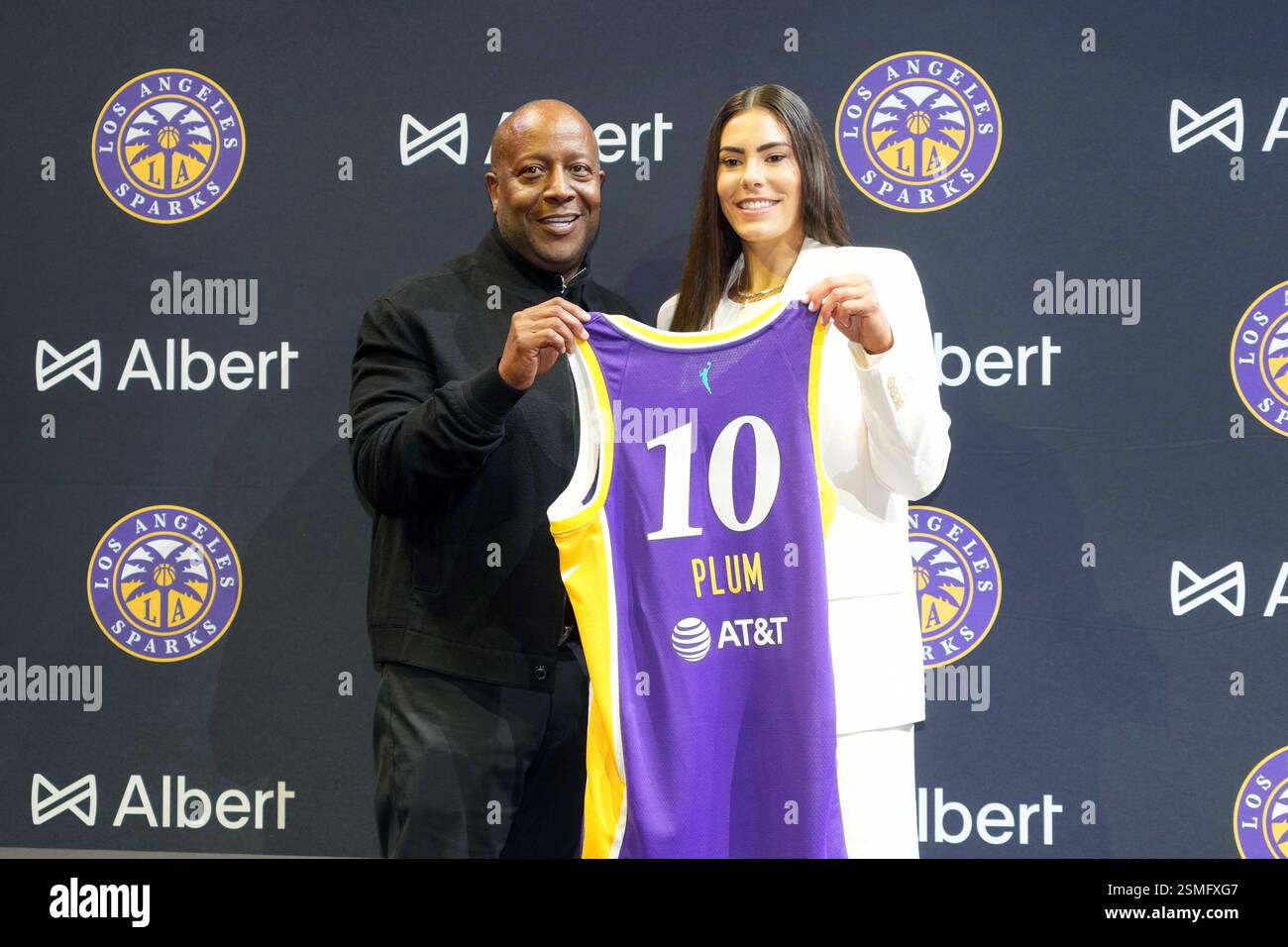 LA Sparks guard Kelsey Plum (right) poses with Sparks CEO and governor Eric Holoman introductory ...