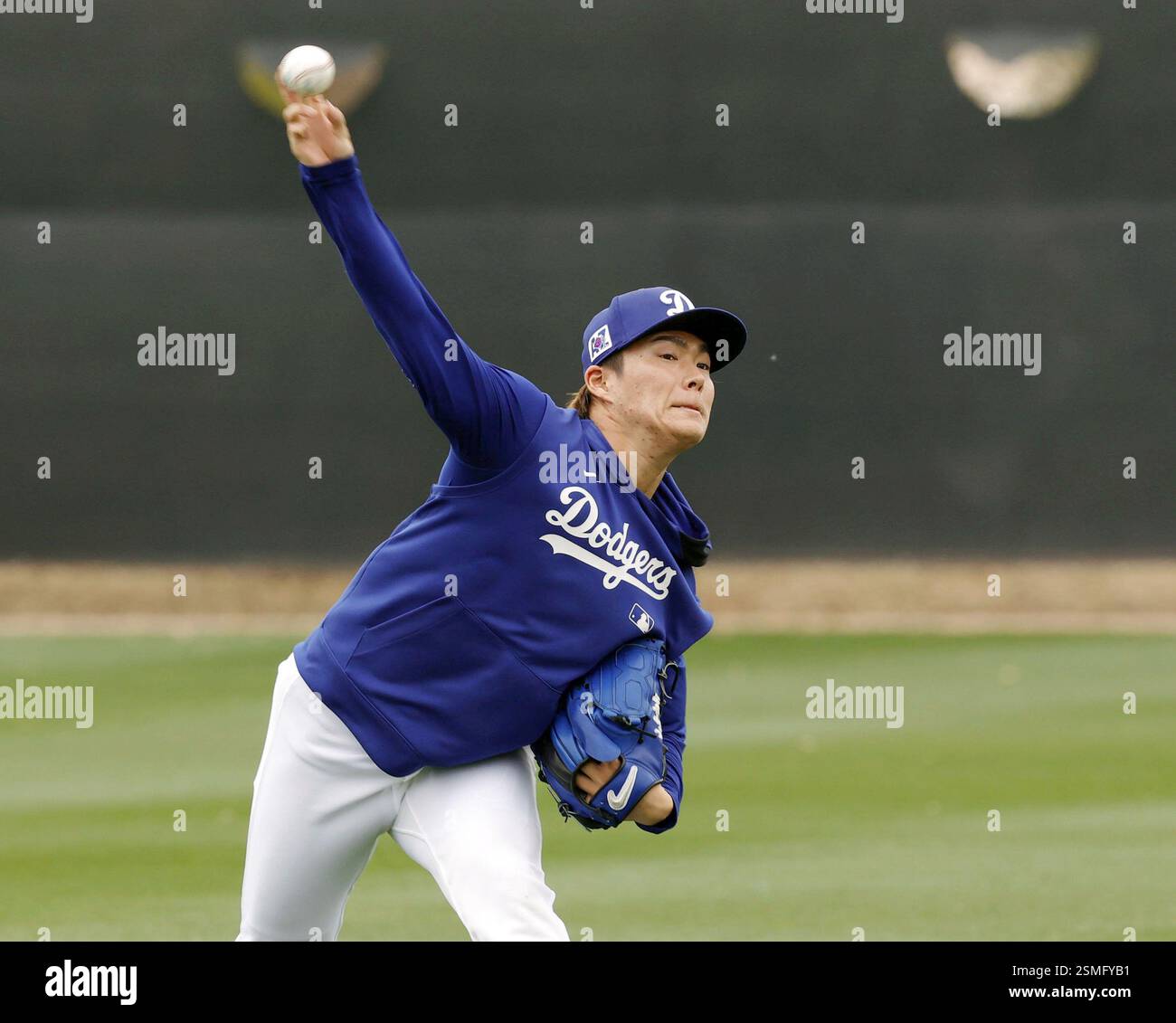 Los Angeles Dodgers pitcher Yoshinobu Yamamoto plays catch at the team ...