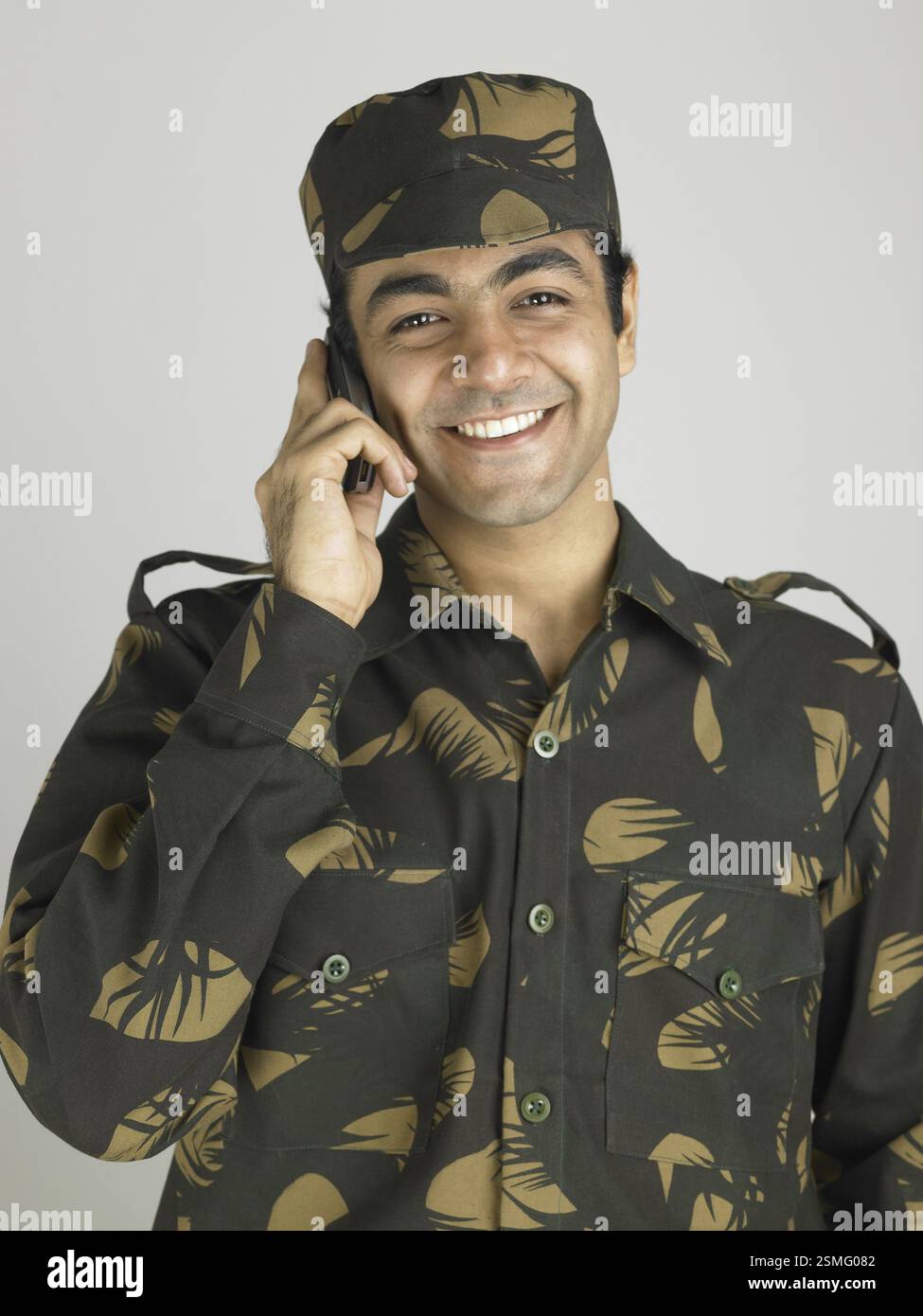 Indian army soldier talking on mobile phone MR#702A Stock Photo - Alamy
