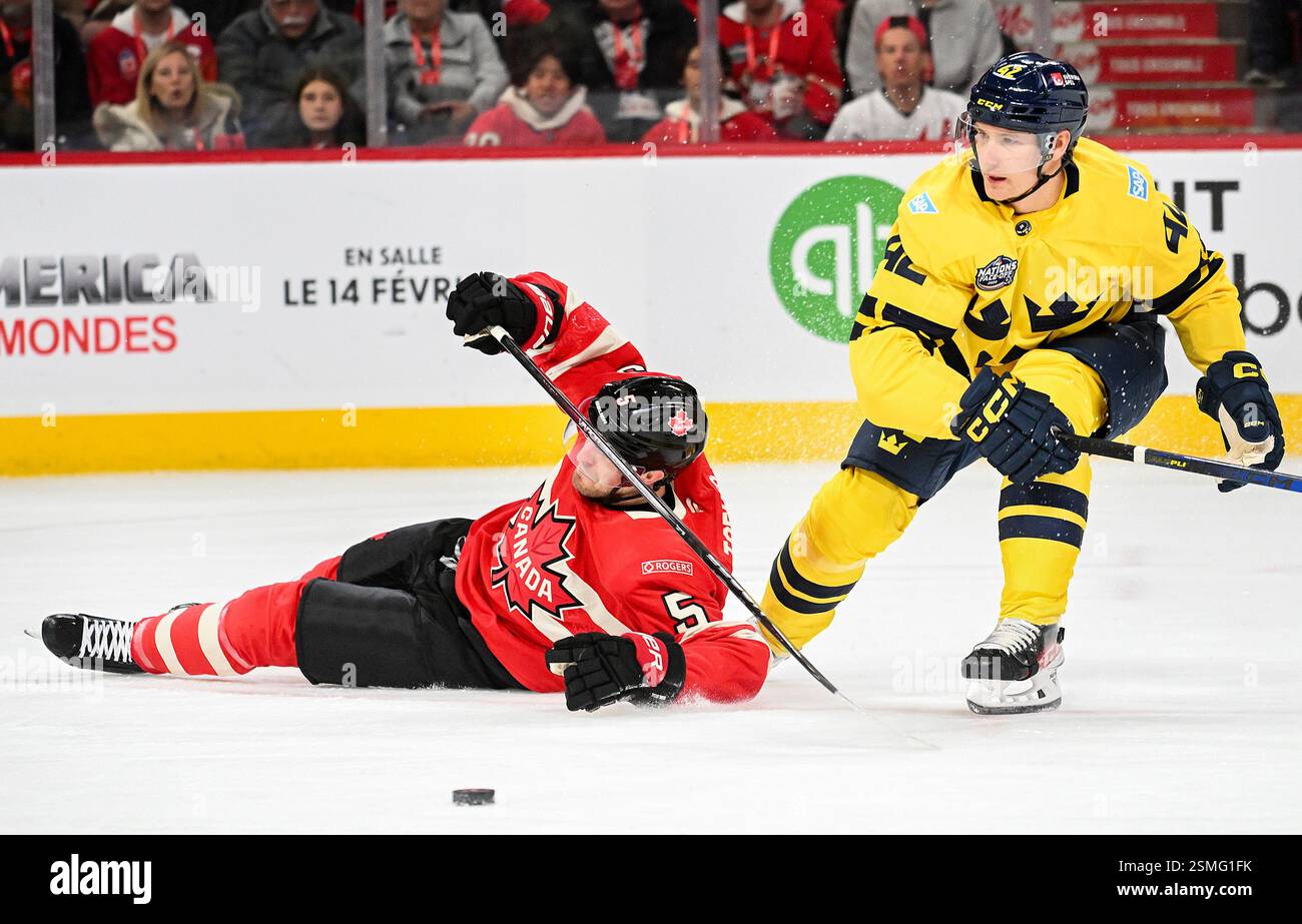 Canada's Devon Toews (5) and Sweden's Gustav Forsling (42) collide ...