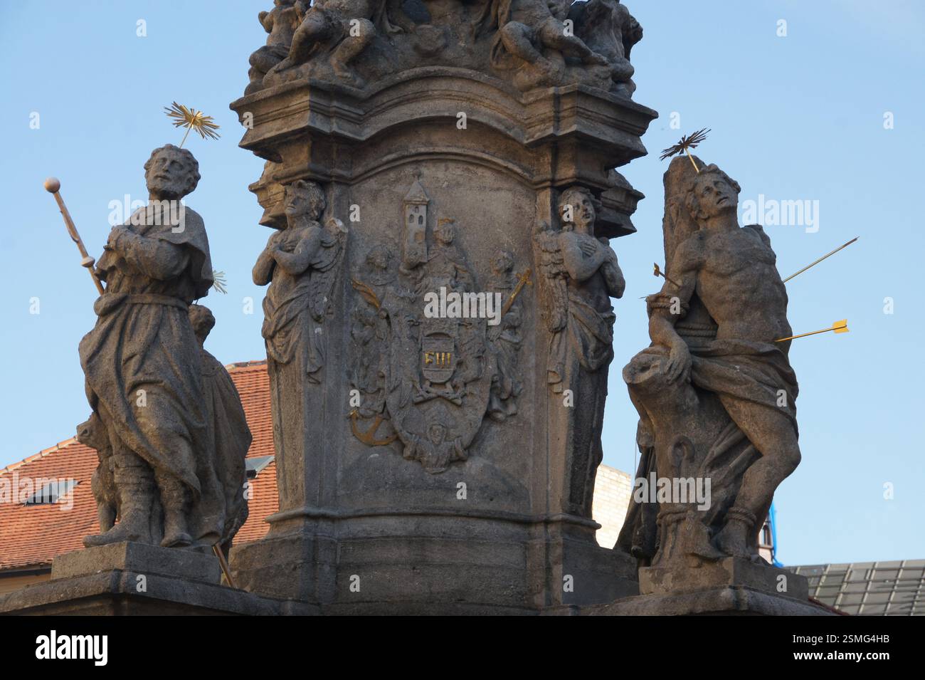 A large castle with a towering central spire dominates the landscape ...