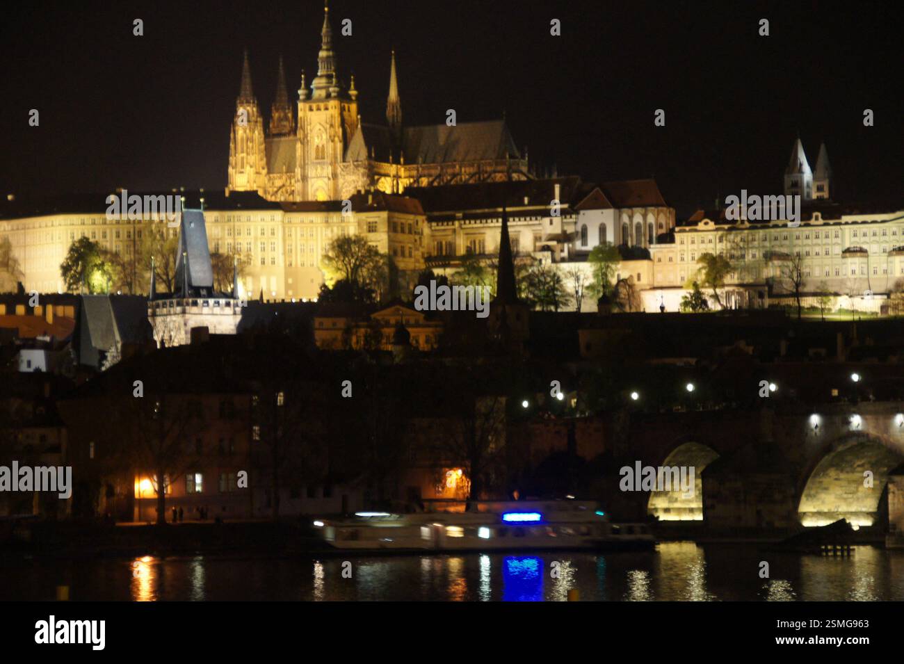 Prague Castle, a majestic complex of buildings illuminated at night ...