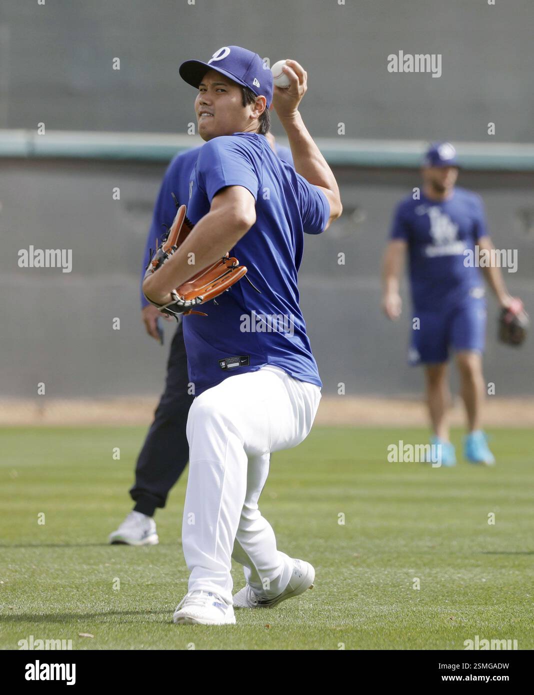 Shohei Ohtani of the Los Angeles Dodgers plays catch at the team's ...