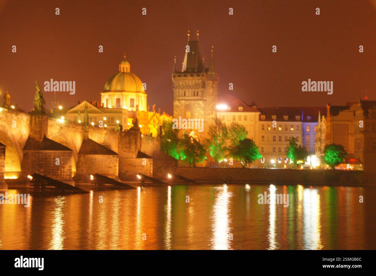 Charles Bridge, a symbol of Prague's rich past, reflects the city's ...