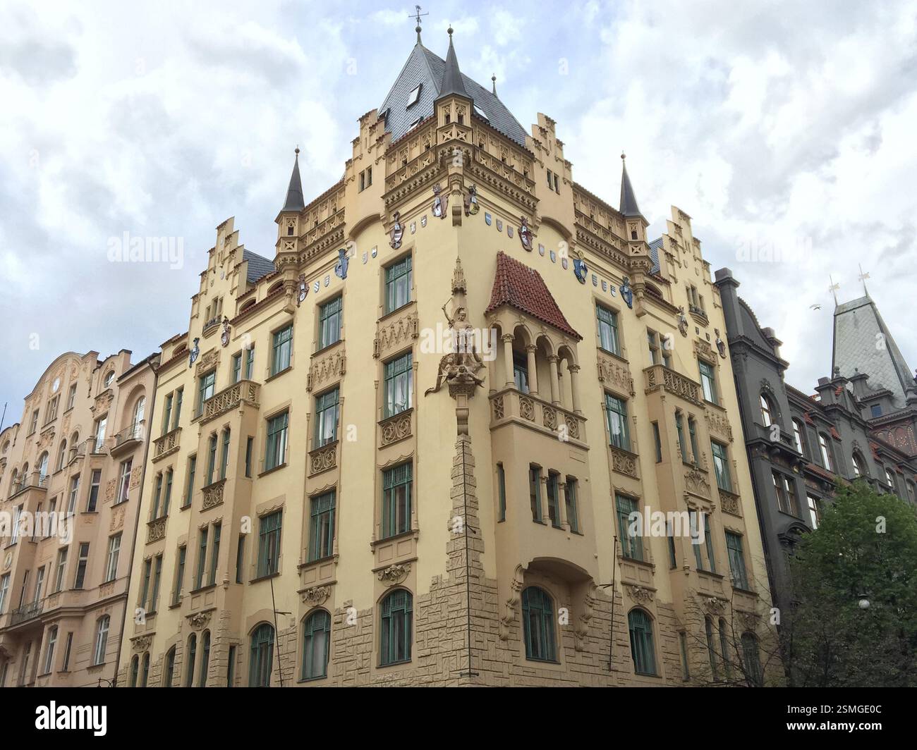 Art Nouveau building Czech Republic. Yellow facade with ornate details ...