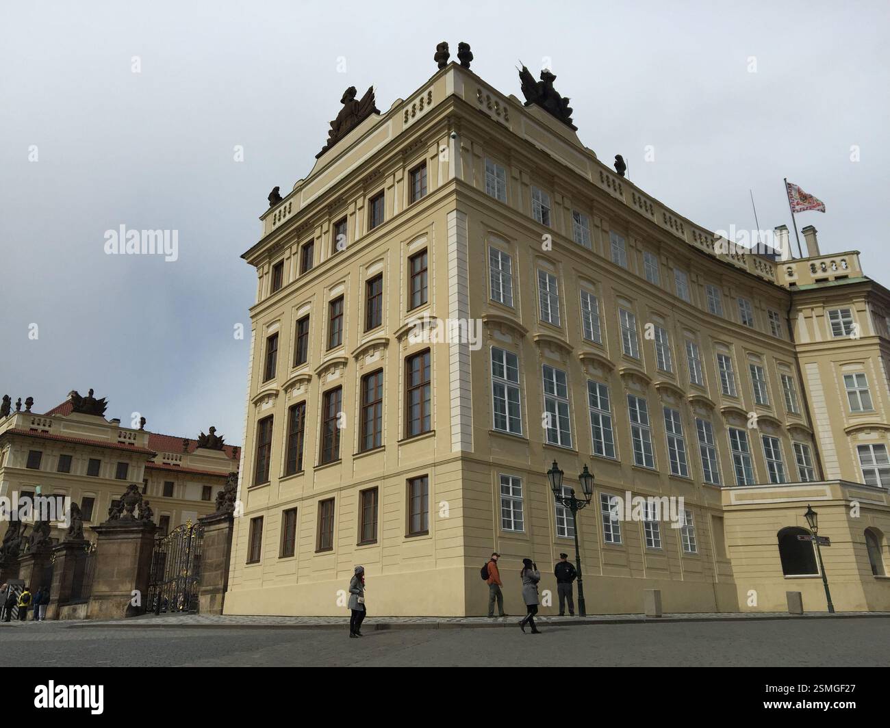 Old Royal Palace, Prague Castle. Yellow building with ornate windows ...