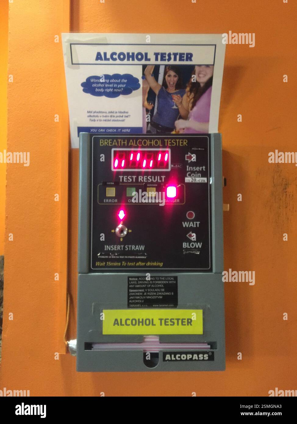 Breathalyzer device measures blood alcohol level. Indicates level ...